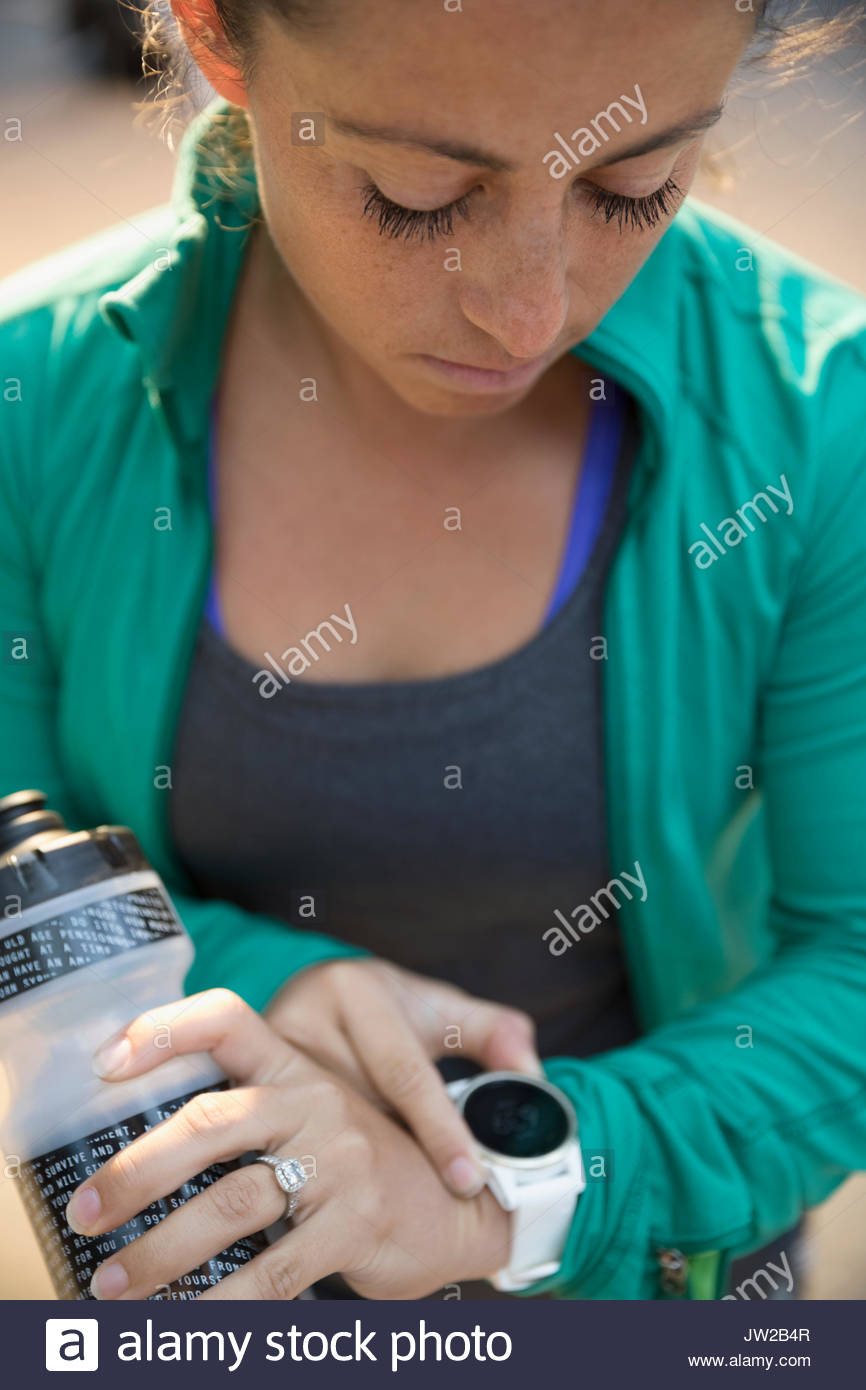 Checking the time running hispanic hi-res stock photography and images ...
