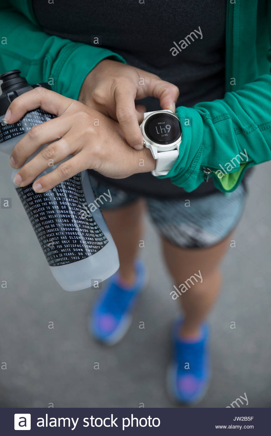 Checking the time running hispanic hi-res stock photography and images ...
