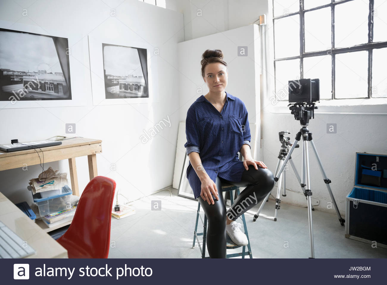Person sitting on a stool hi-res stock photography and images - Alamy