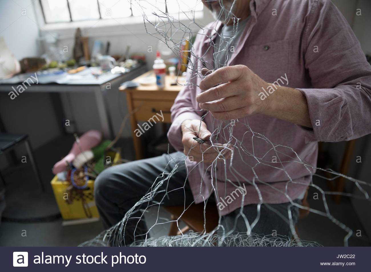 Man in wire hi-res stock photography and images - Alamy