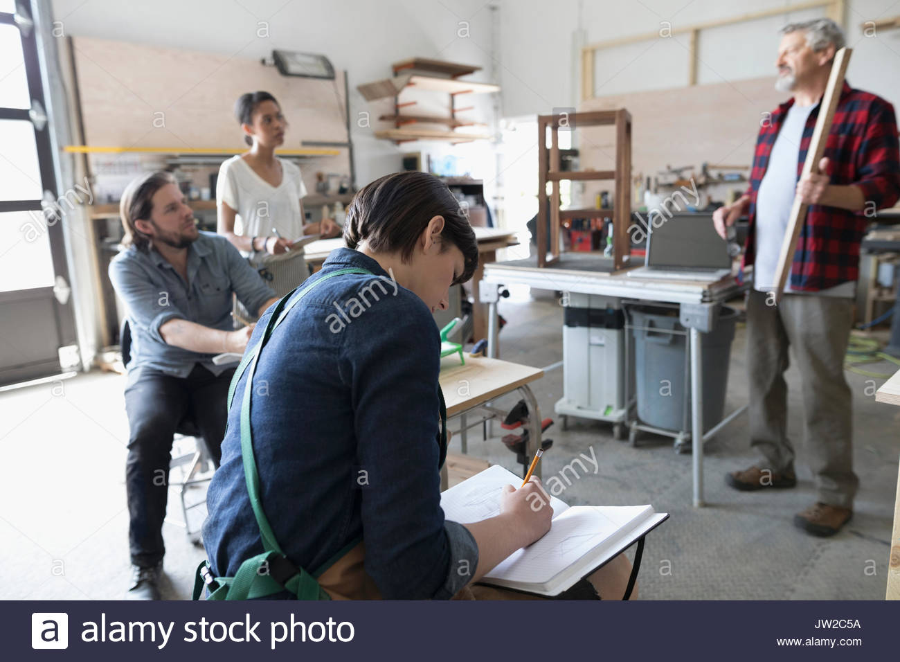 Female carpenter taking notes hi-res stock photography and images - Alamy