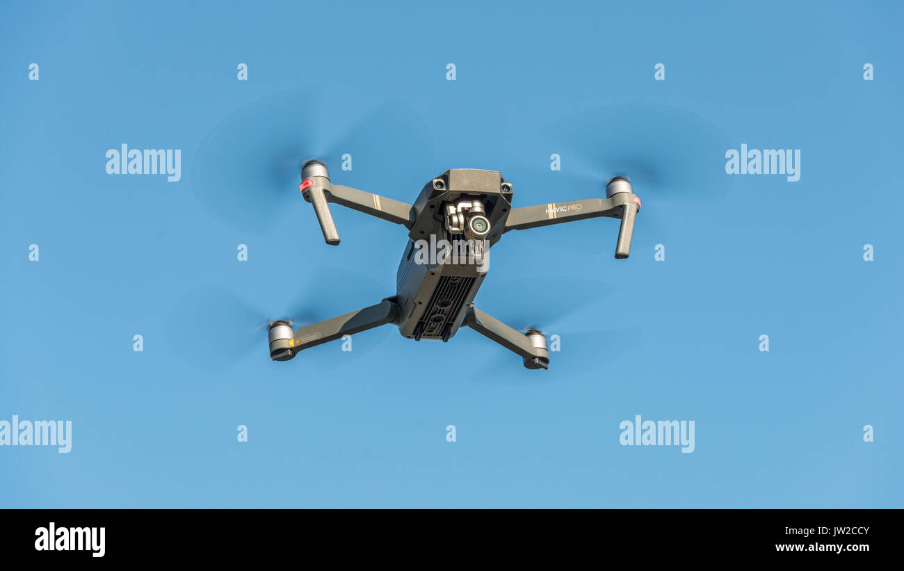 Flying quadrocopter, remote controlled drone with camera, DJI Mavic ...