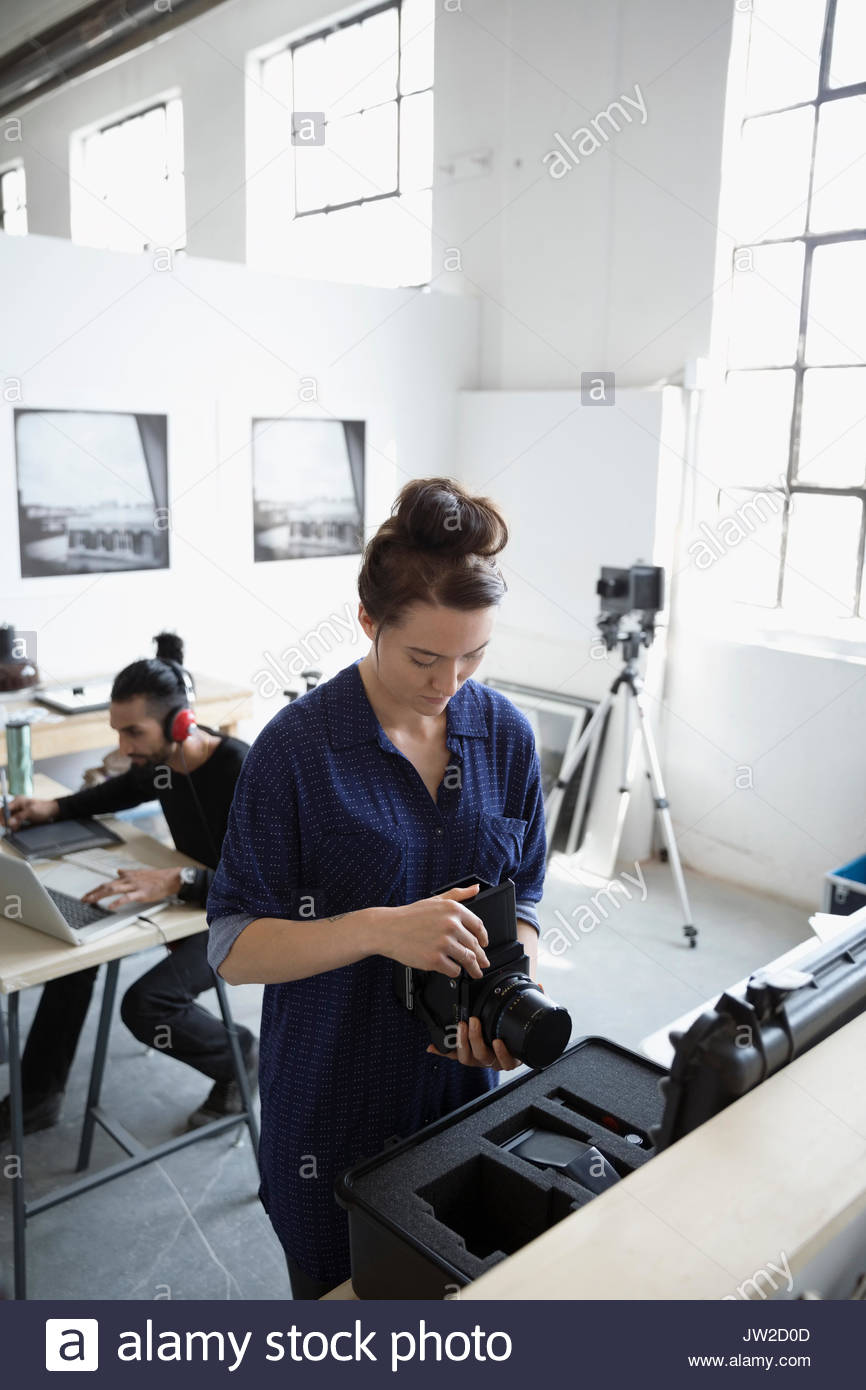 Woman photographer working in studio hi-res stock photography and ...