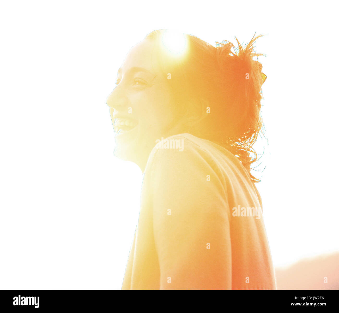 Girl smiling in the sunshine Stock Photo - Alamy