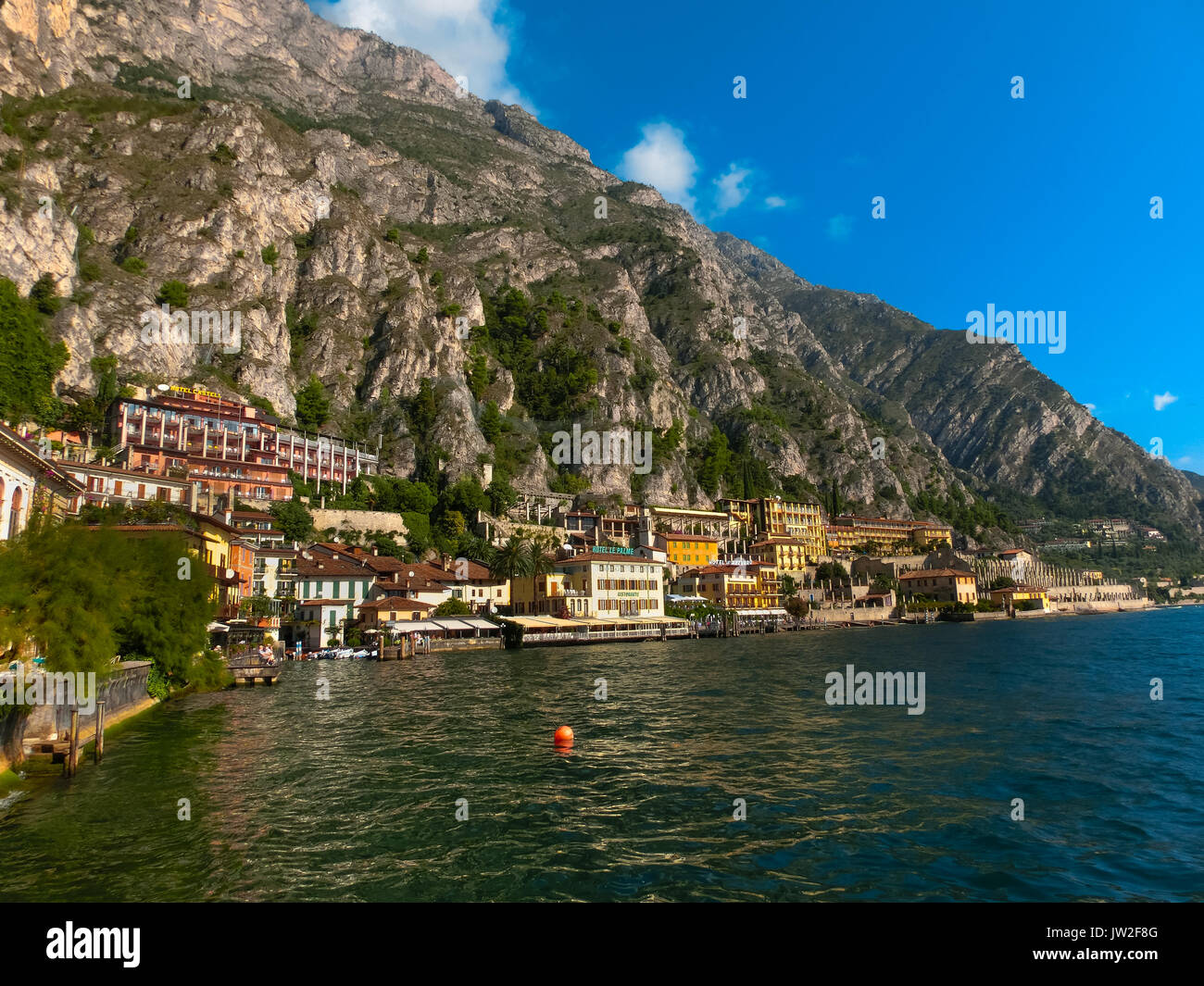Limone sul Garda, Italy - September 21, 2014: The boardwalk with houses ...