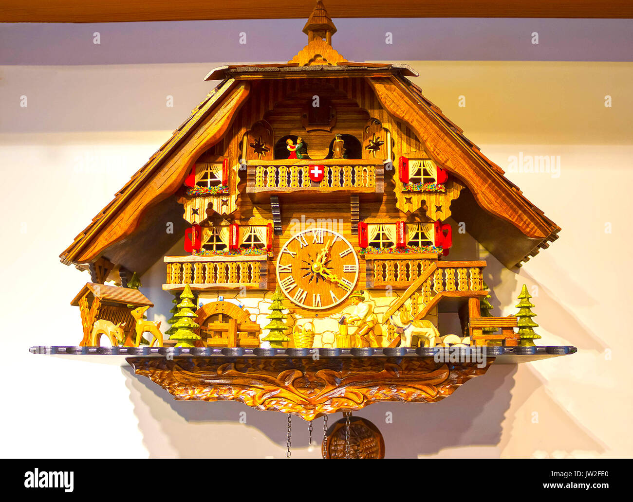 The detail of swiss wooden clock Stock Photo - Alamy