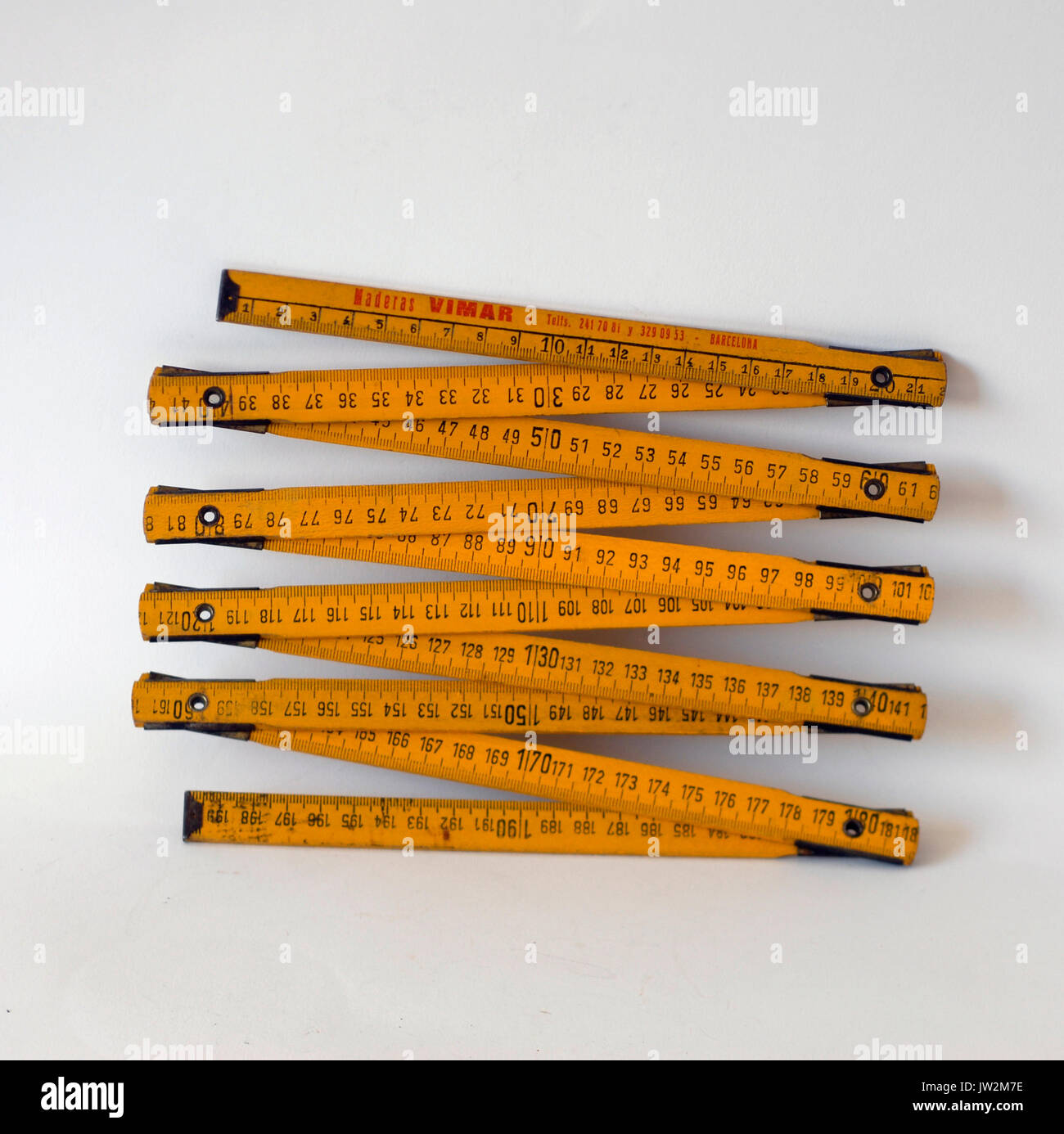 Vintage meter made by wood and yellow painted Stock Photo - Alamy