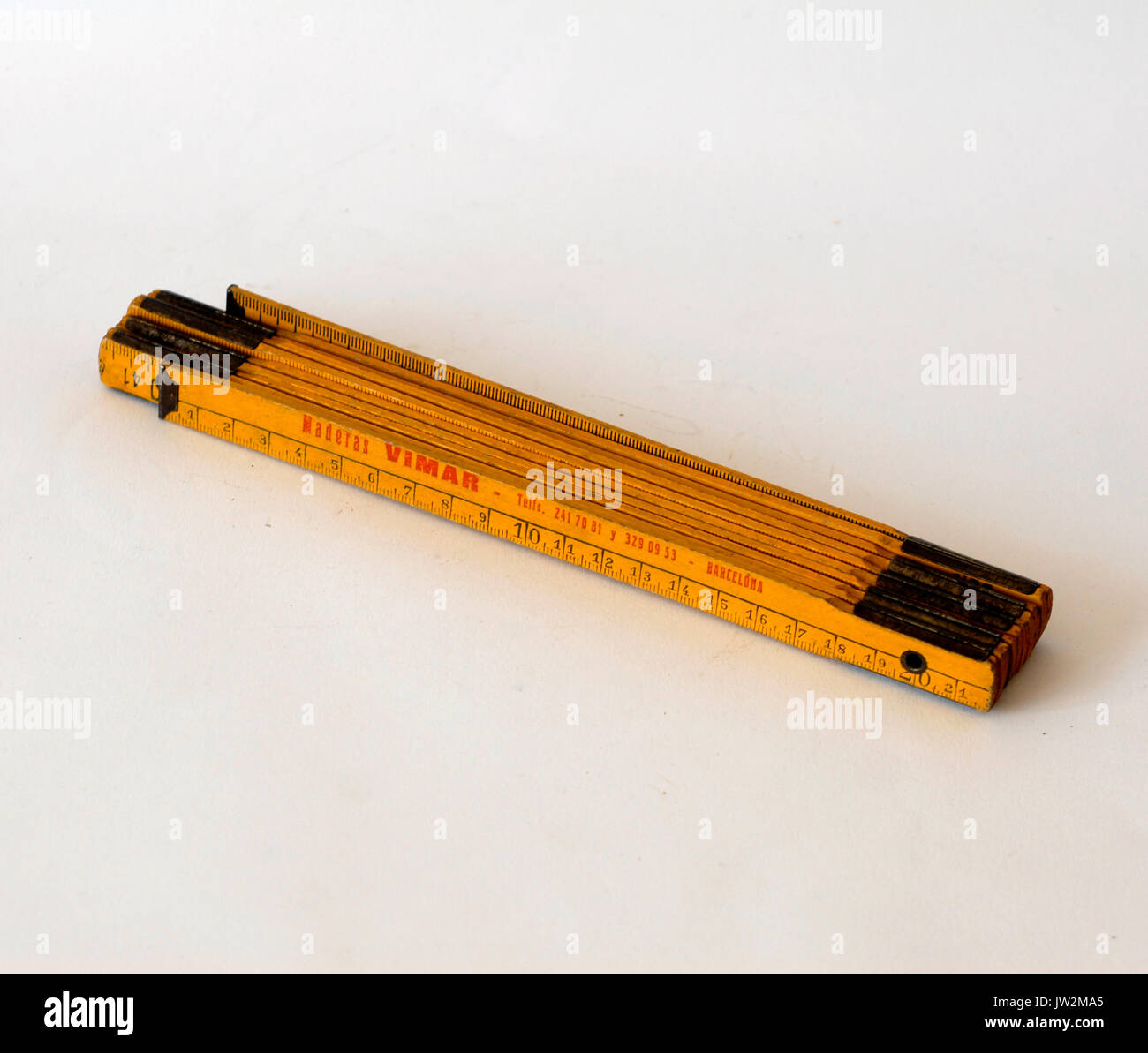 Vintage meter made by wood and yellow painted Stock Photo - Alamy