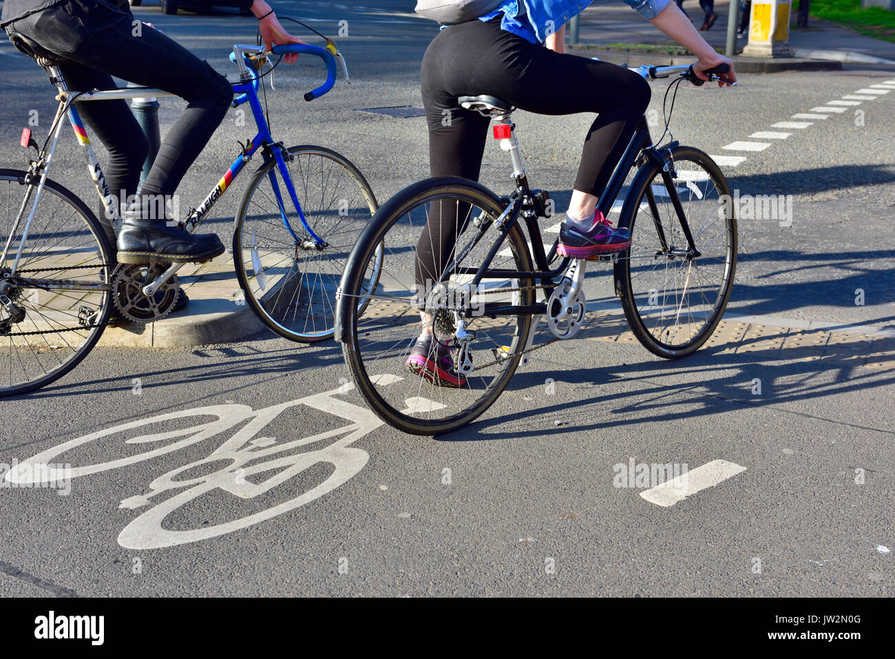 Two cyclists, crossing and bike symbol Stock Photo - Alamy