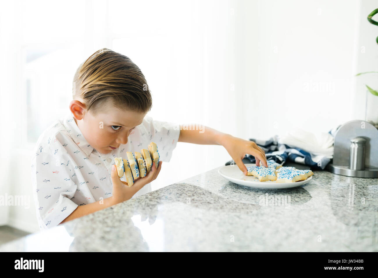Boy stealing food hi-res stock photography and images - Alamy