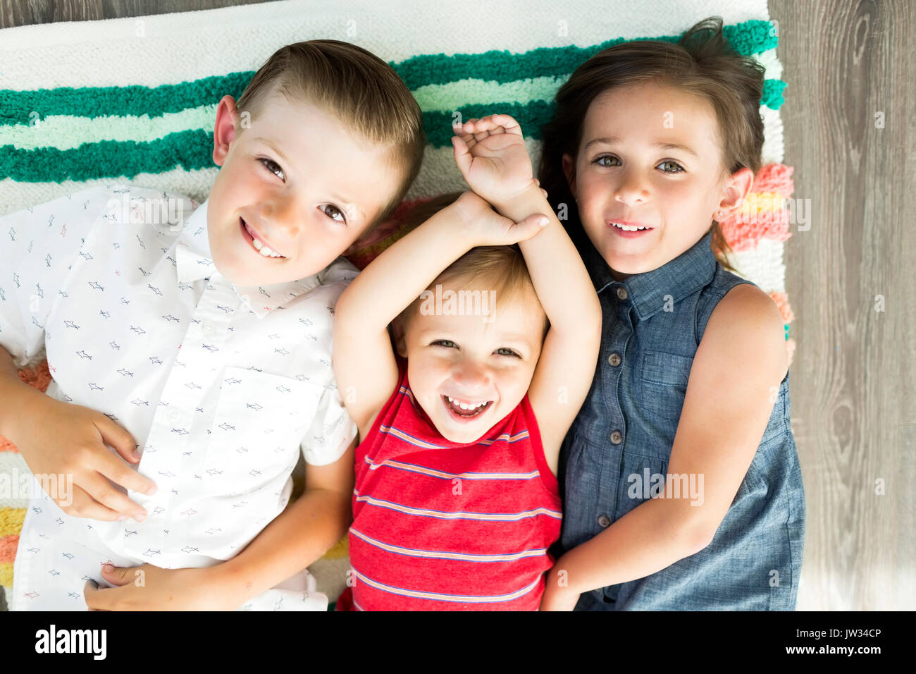 Three siblings side by side hi-res stock photography and images - Alamy