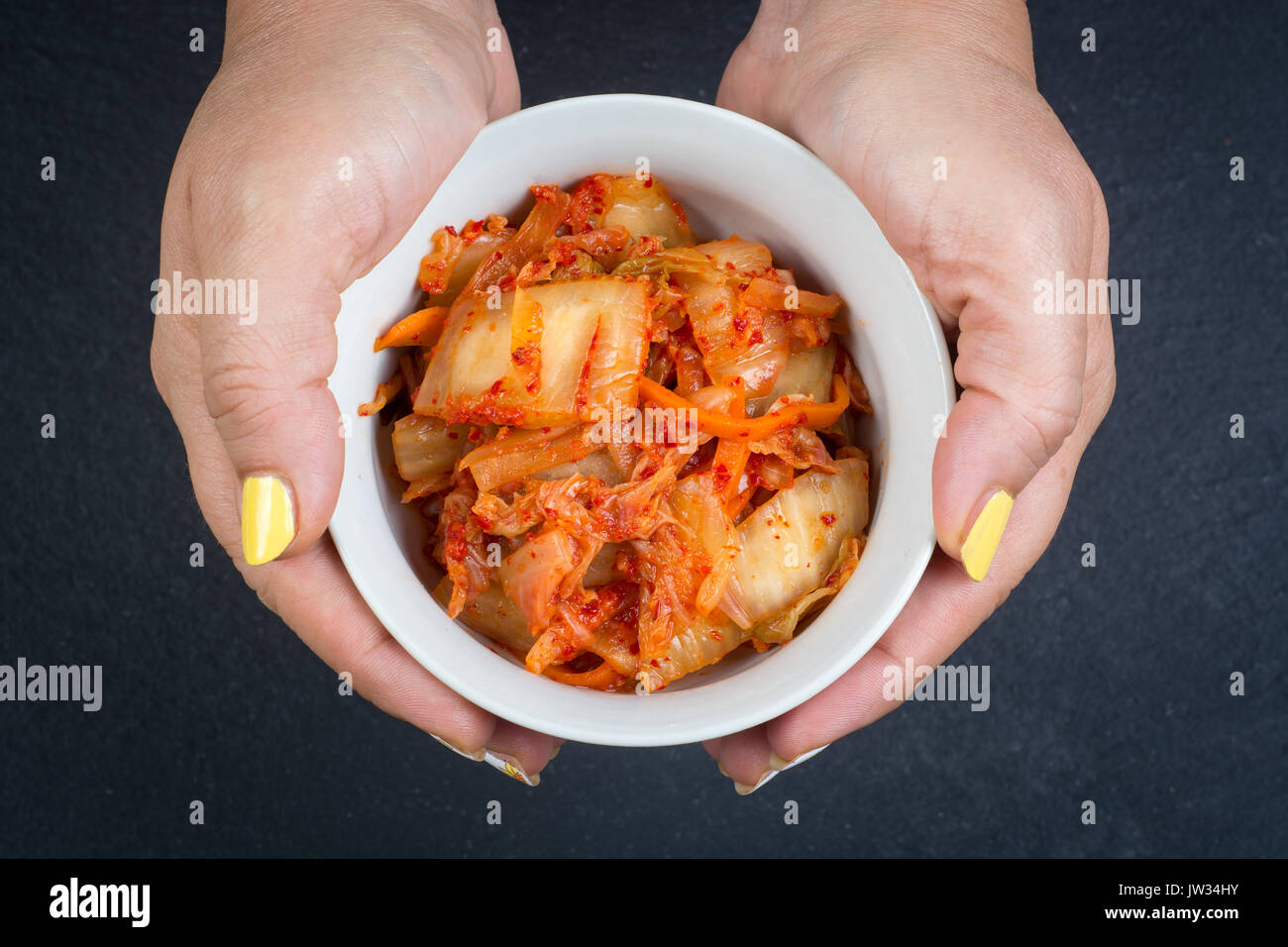 Kimchi - Korean superfood. Pickled chinese cabbage in bowl on slate ...