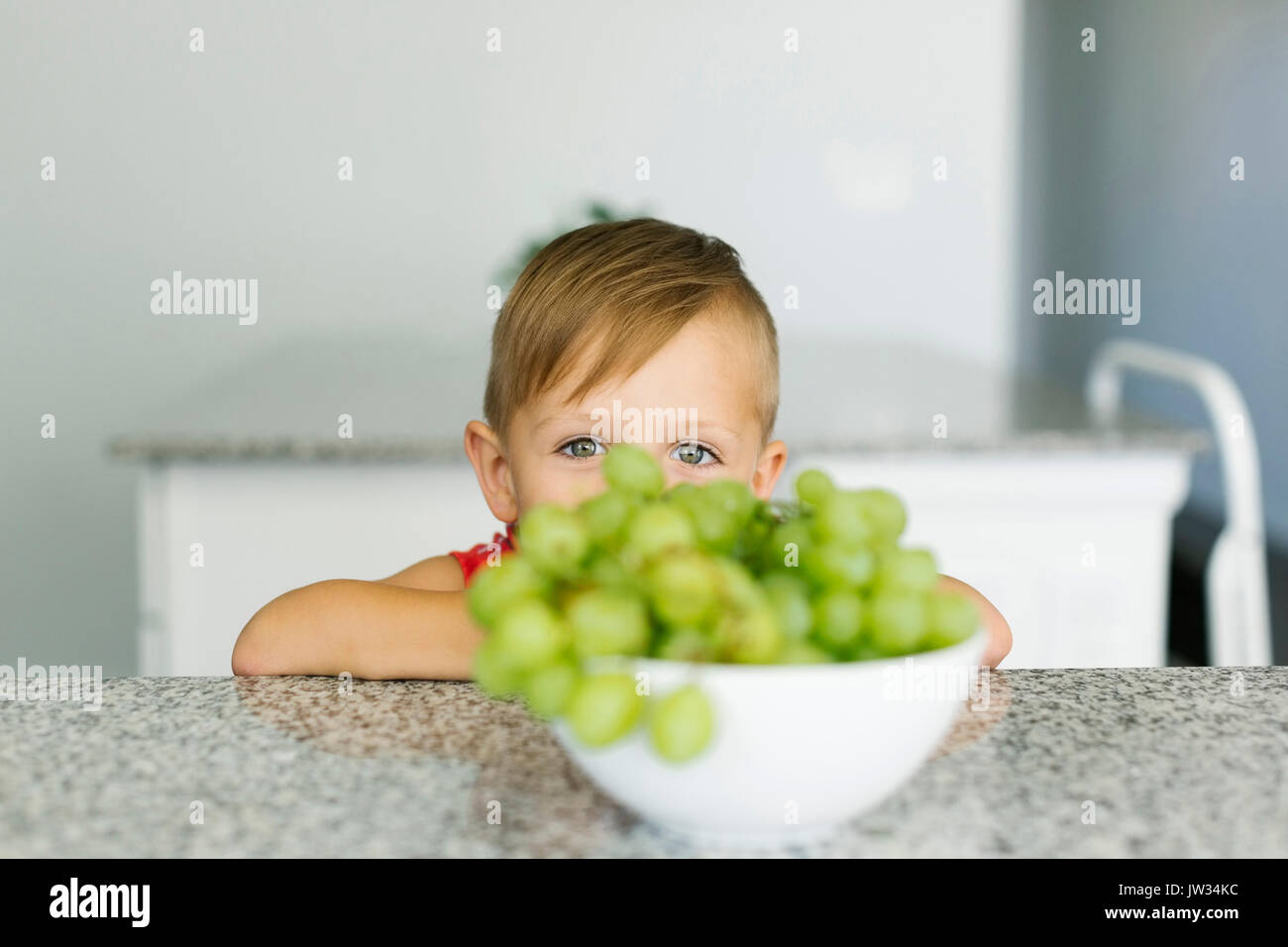 Boy eating grapes hi-res stock photography and images - Alamy