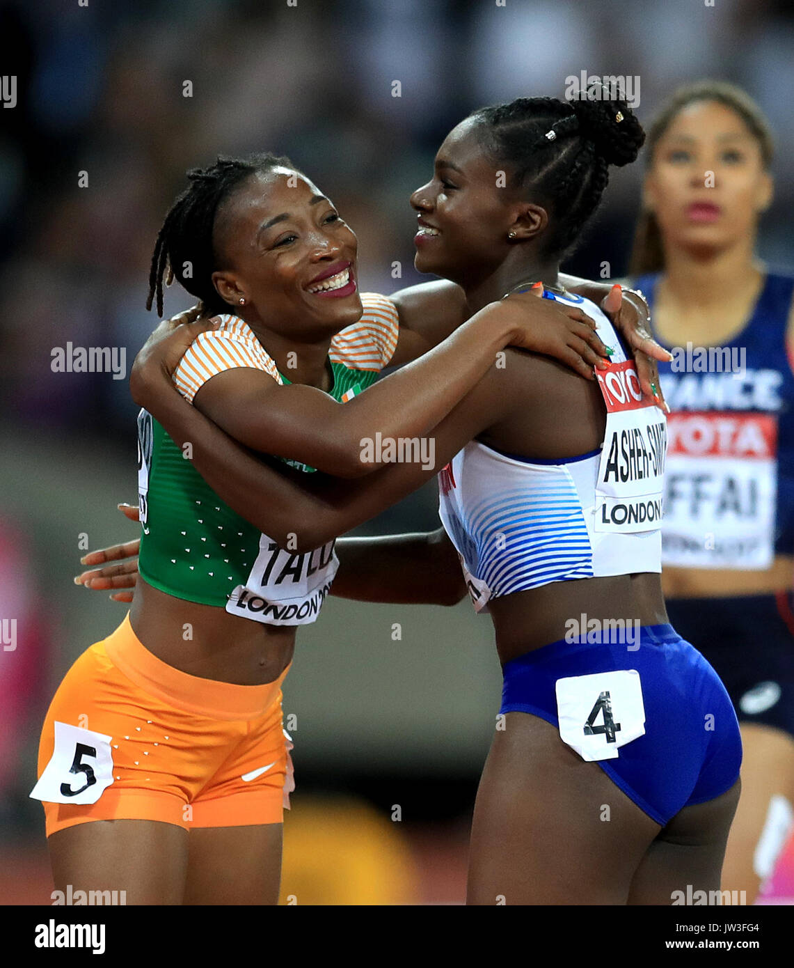 Ivory Coast's Marie-Josee Ta Lou (left) with Great Britain's Dina Asher ...