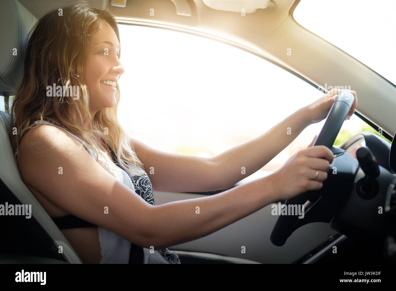 Back view woman driving car hi-res stock photography and images - Alamy