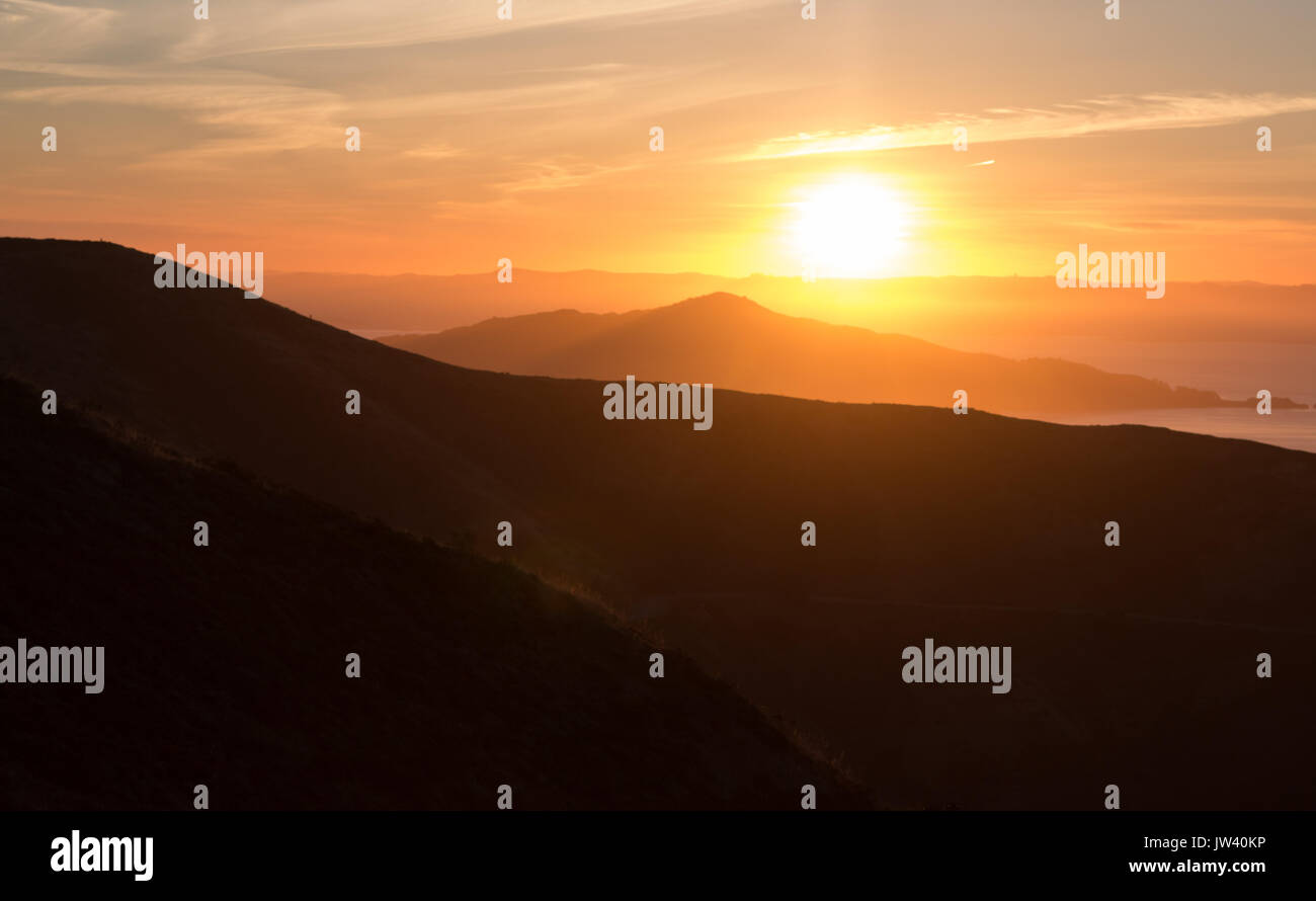 Bright Sun Rising Over the Mountains Stock Photo - Alamy