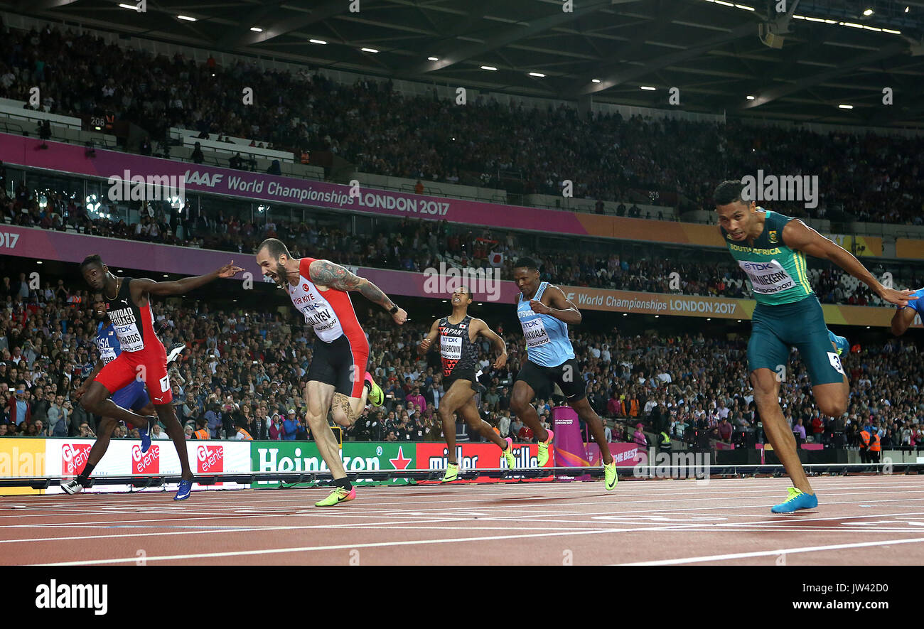 Turkey's Ramil Guliyev (second from left) dips on the finish line to ...