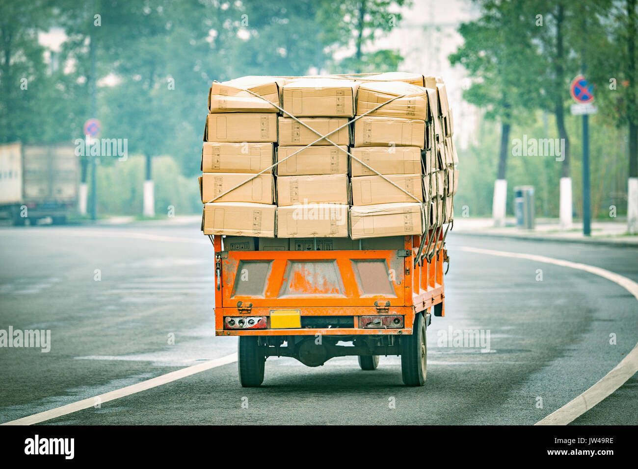 Small freight car with cardboard boxes. China Stock Photo - Alamy