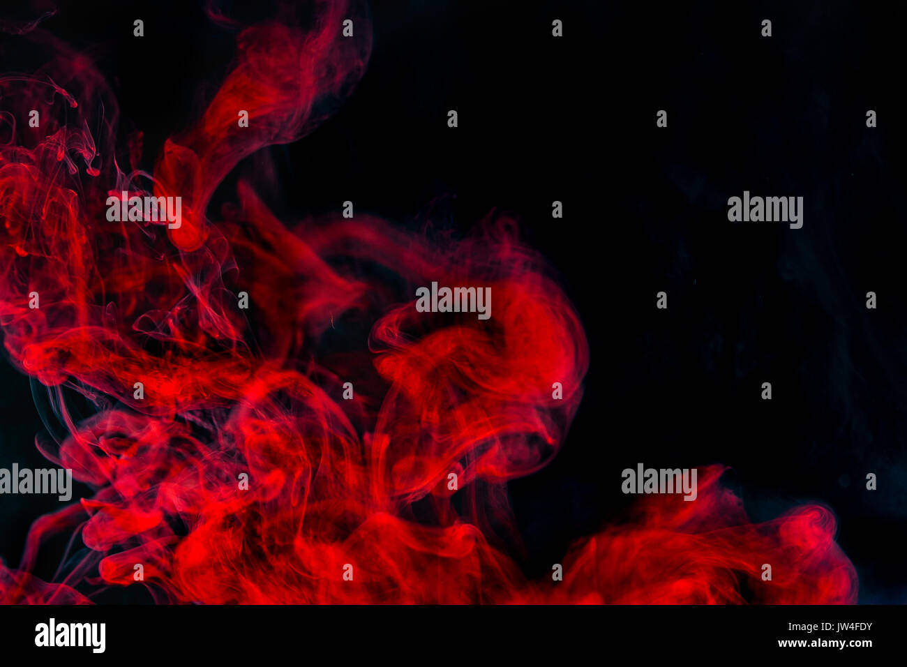 Abstract background, red smoke texture in the air. Smoke fragments ...