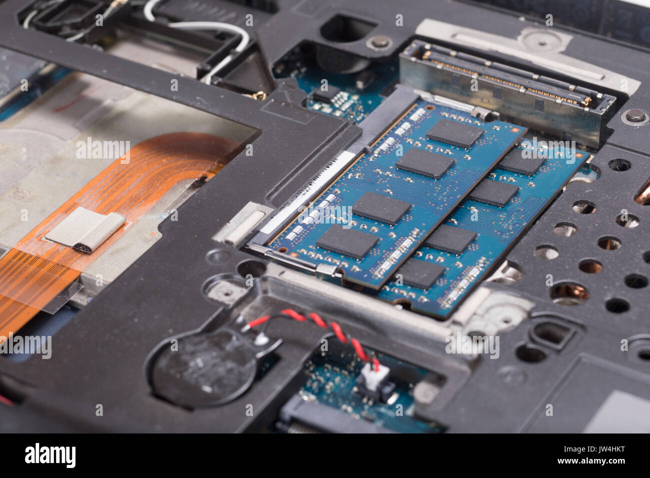 A close up of the internal electrical parts and components of a laptop ...