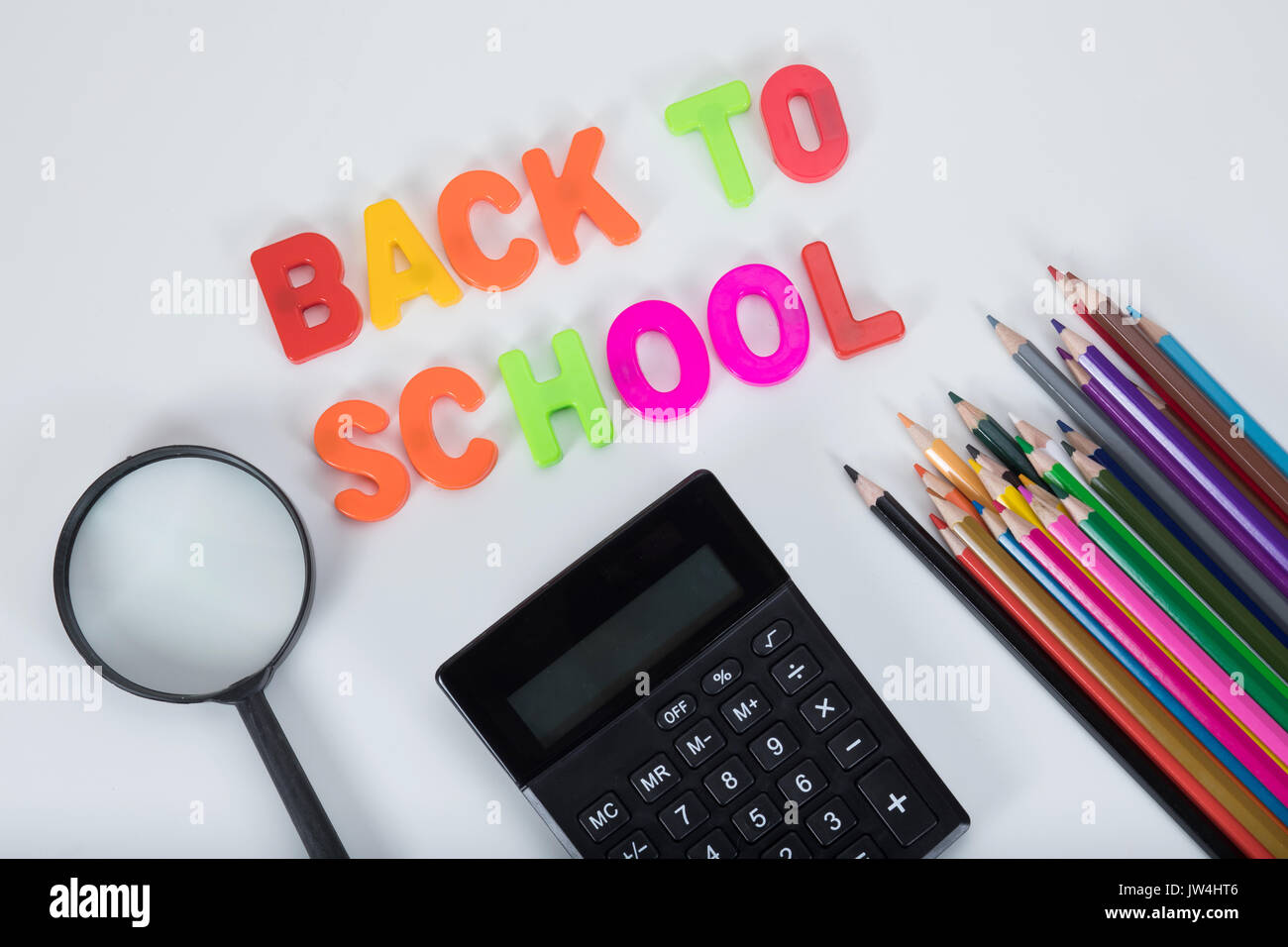 Back to school written with colourful alphabet letters alongside a ...