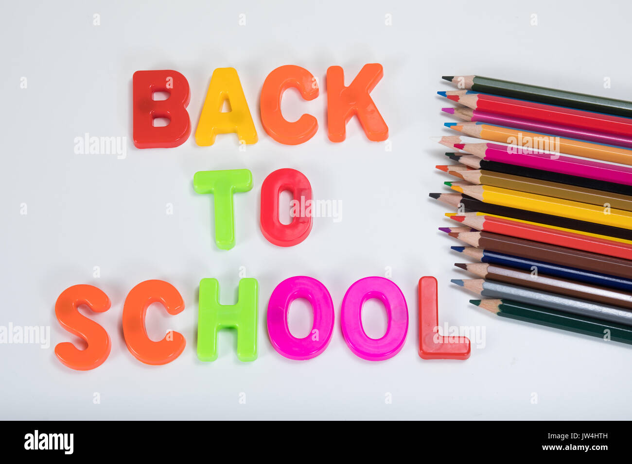 Back to school written with colourful alphabet learning letters beside ...