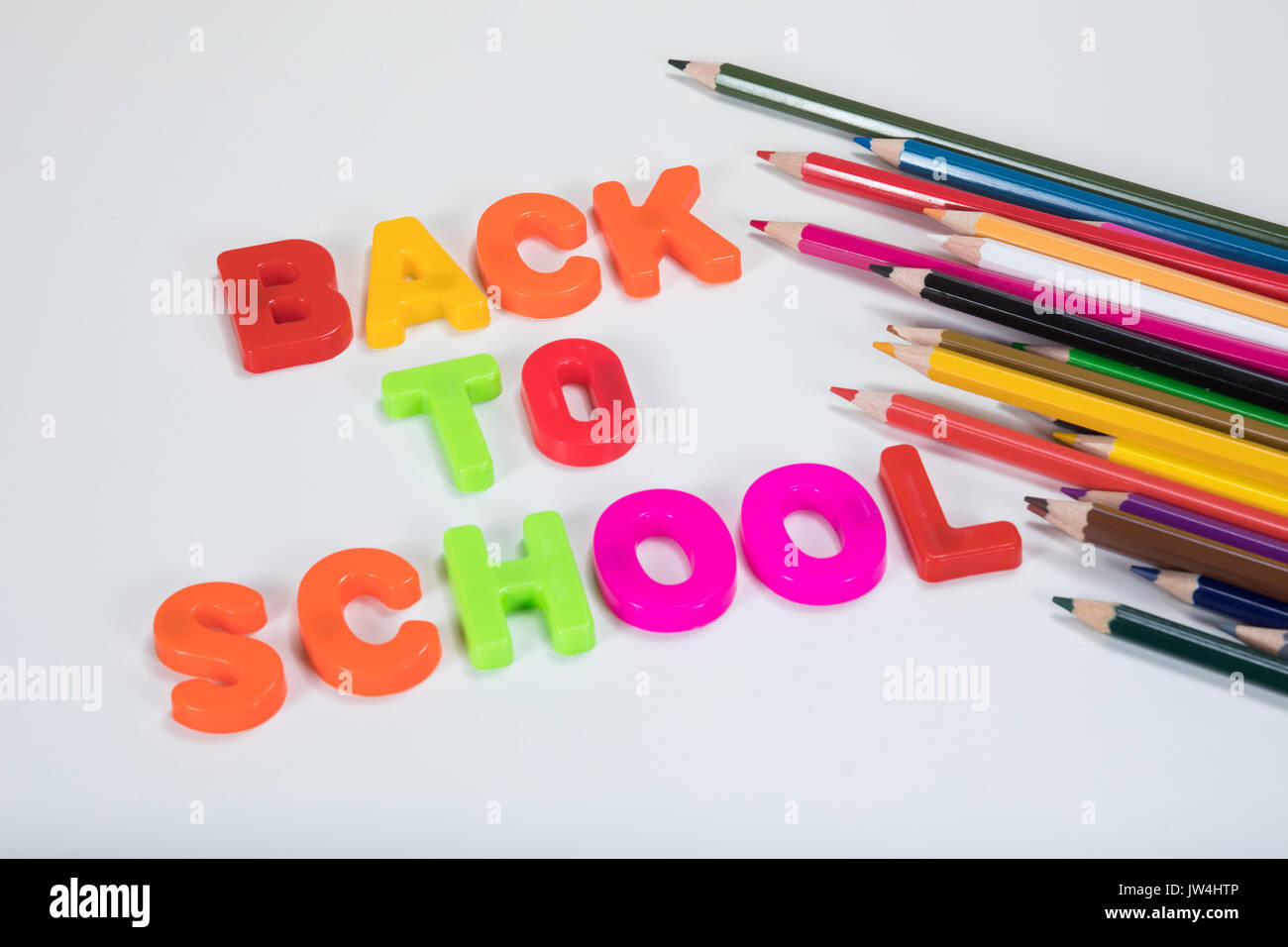 Back to school written with colourful alphabet learning letters beside ...