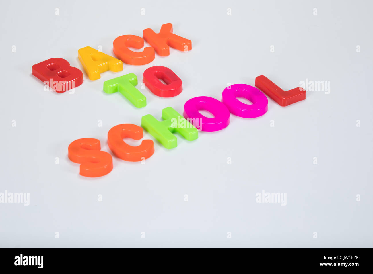 Back to school written with colourful alphabet learning letters on a ...