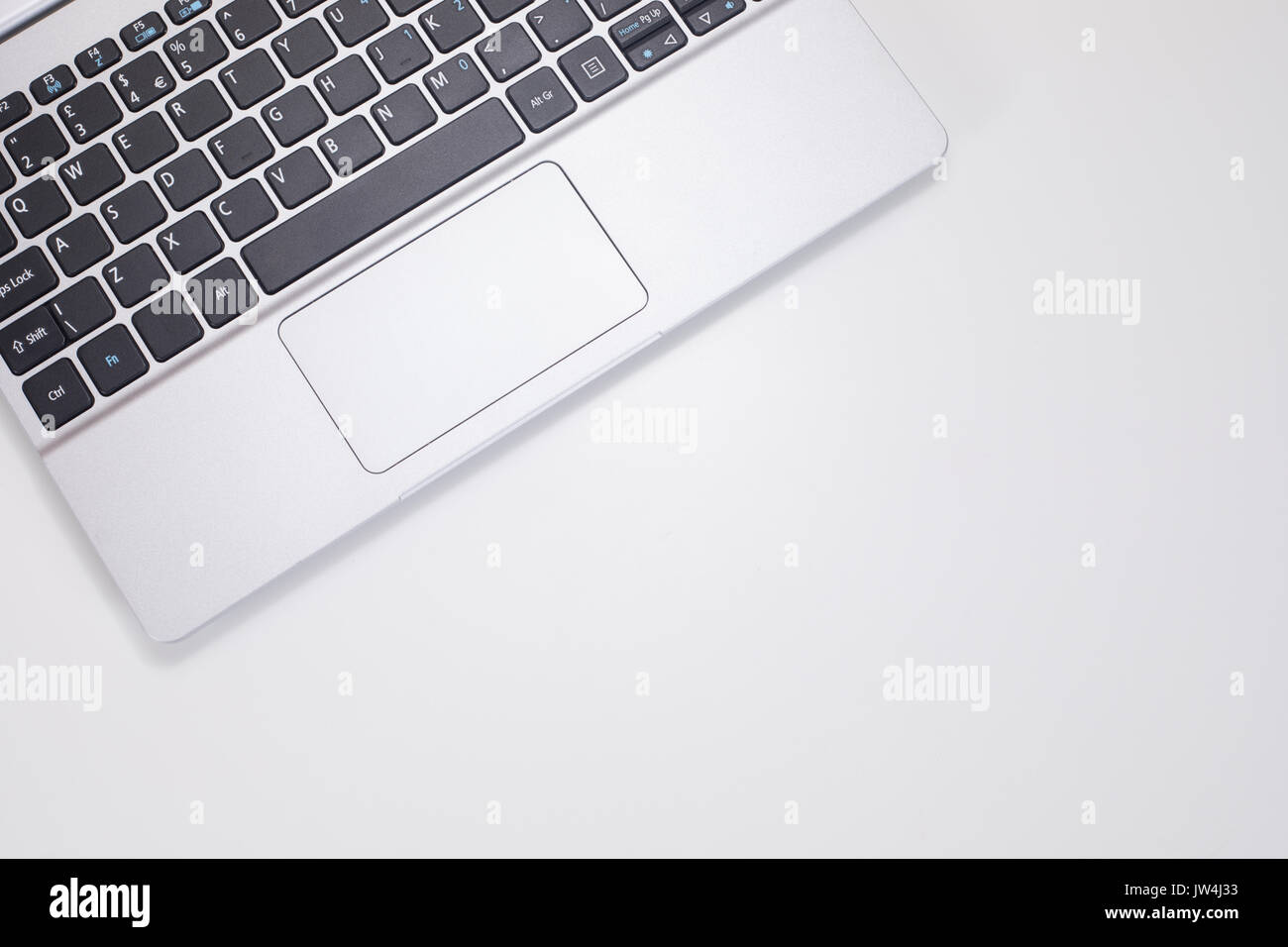 Abstract close up of laptop computer keyboard and tracking pad on a ...