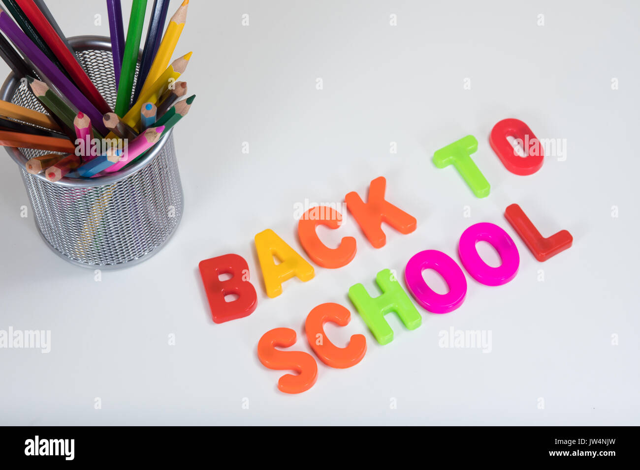 Back to school written with colourful alphabet learning letters next to ...