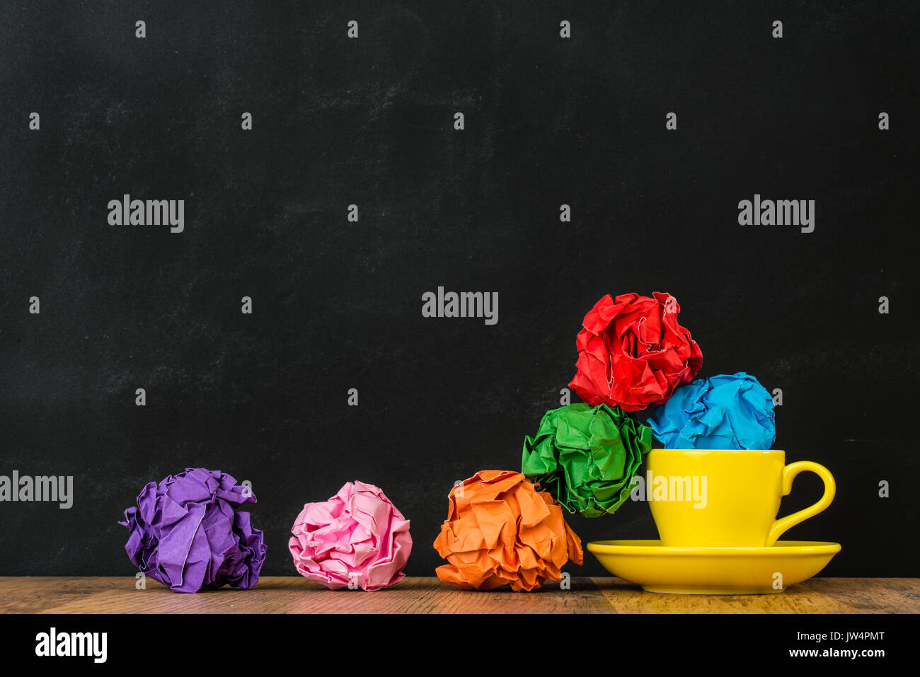 colorful junk paper balls from yellow hot coffee cups group fell out ...