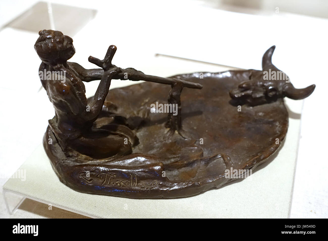 A bronze sculpture titled *Smoking to the Spirit of the Buffalo* by ...