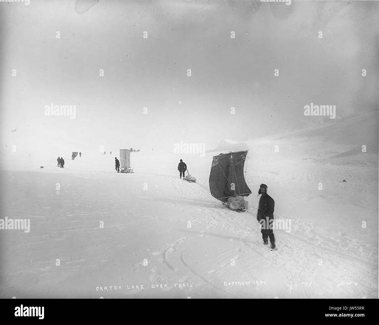 Crossing frozen Crater Lake with sleds outfitted with sails, British ...