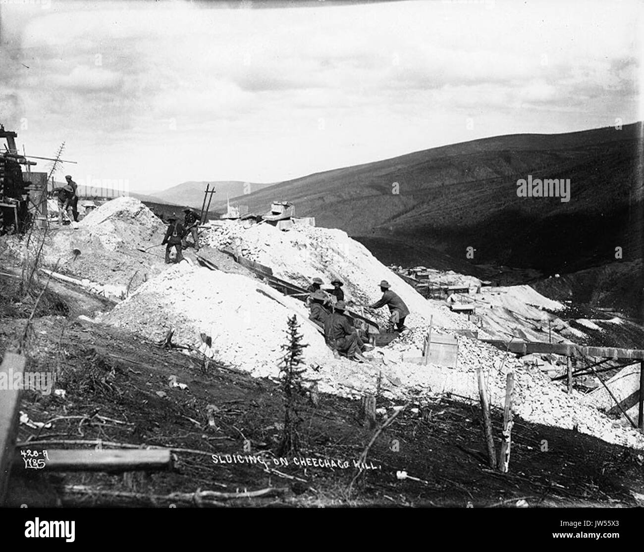 Men operating sluice on a mining claim on Cheechako Hill, Yukon ...