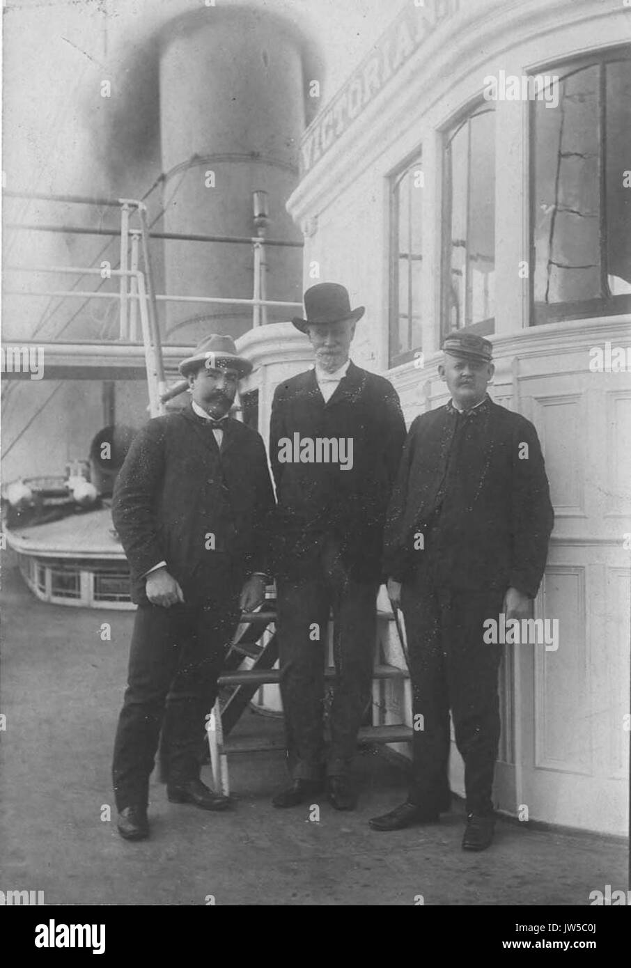 Three crew members on deck of steamship VICTORIAN, Washington, ca 1900 ...