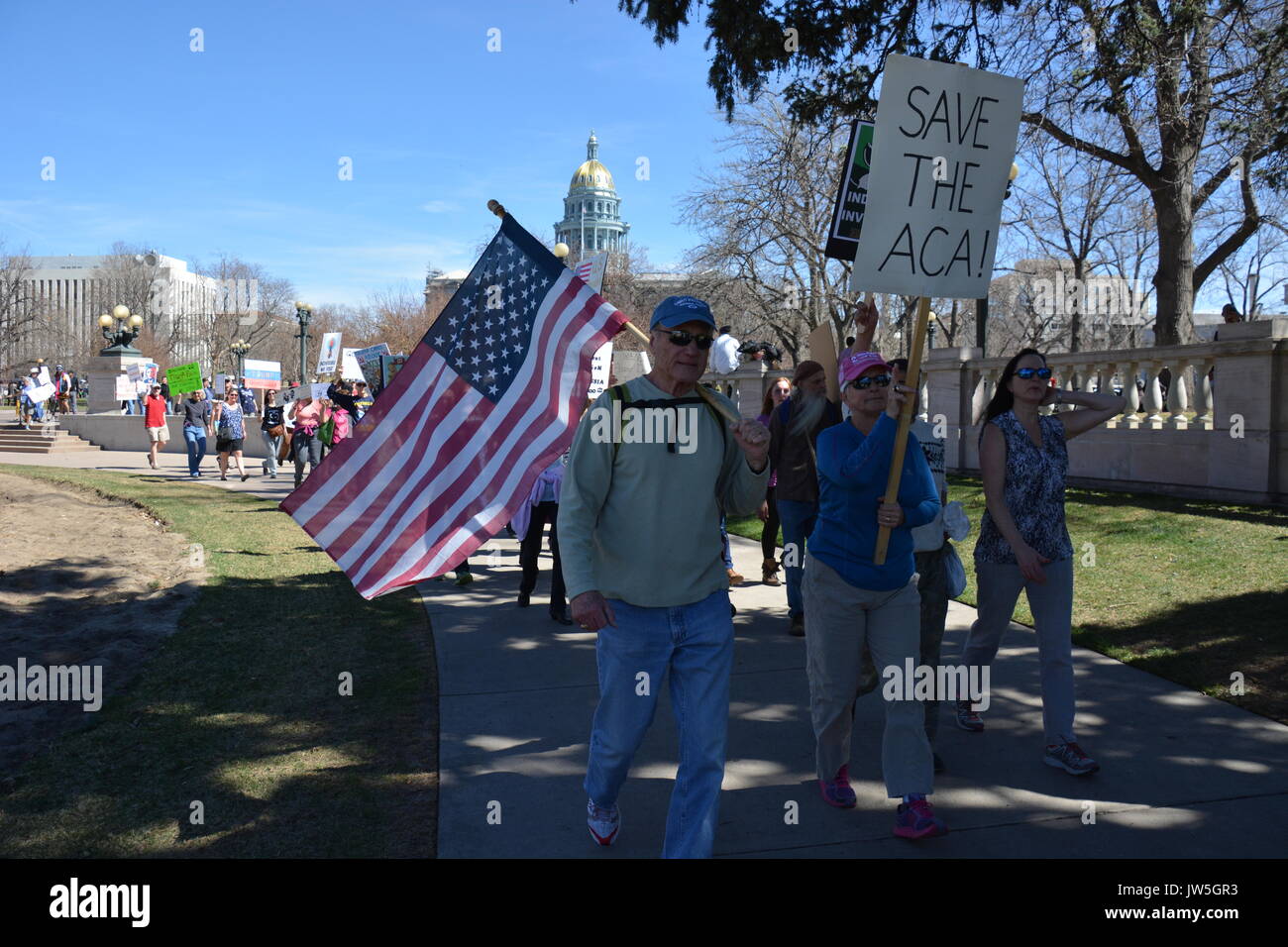 Protesters marching with signs hi-res stock photography and images - Alamy