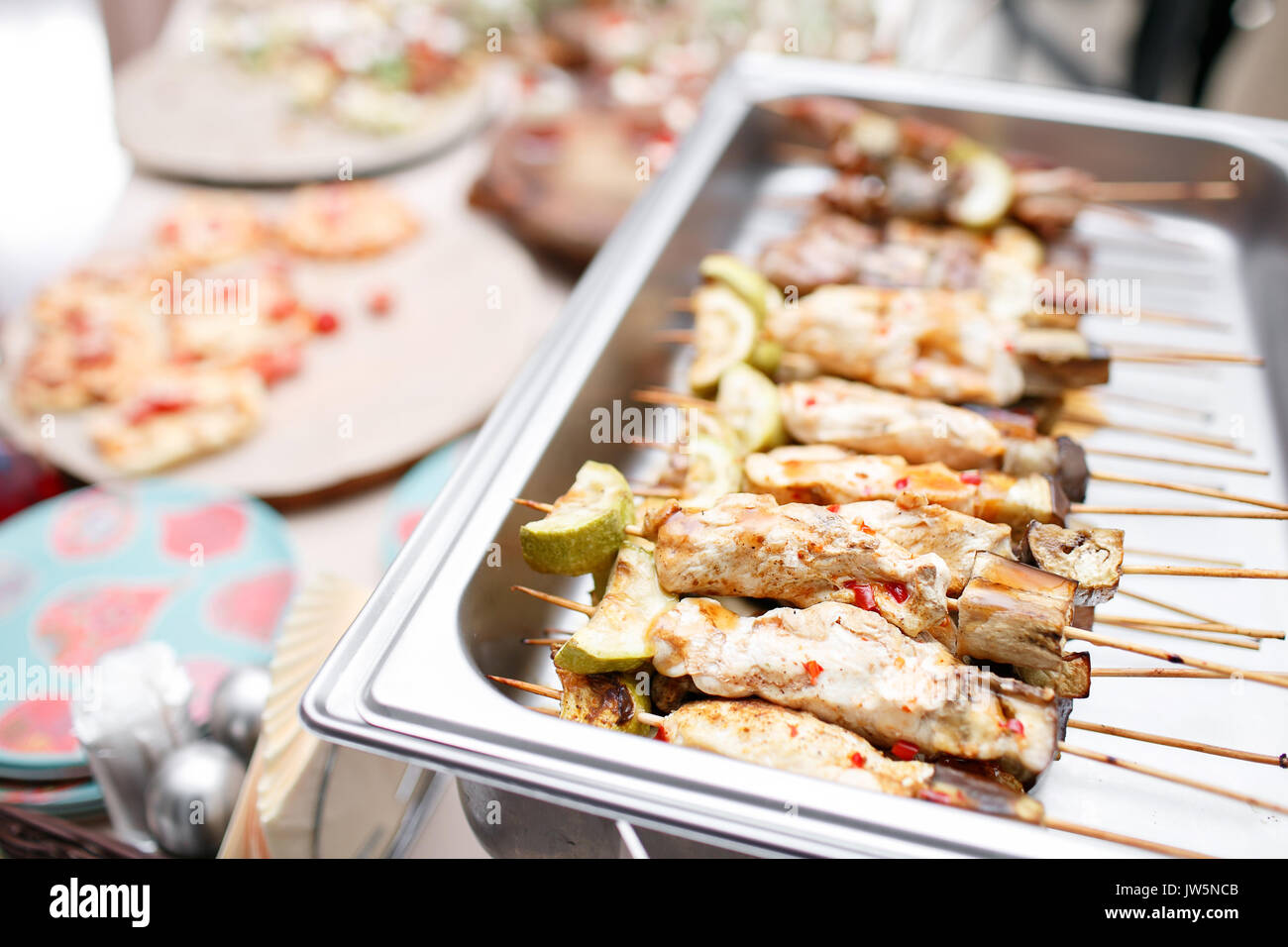 Breakfast buffet in hotel or catering. Grilled chicken on bamboo ...
