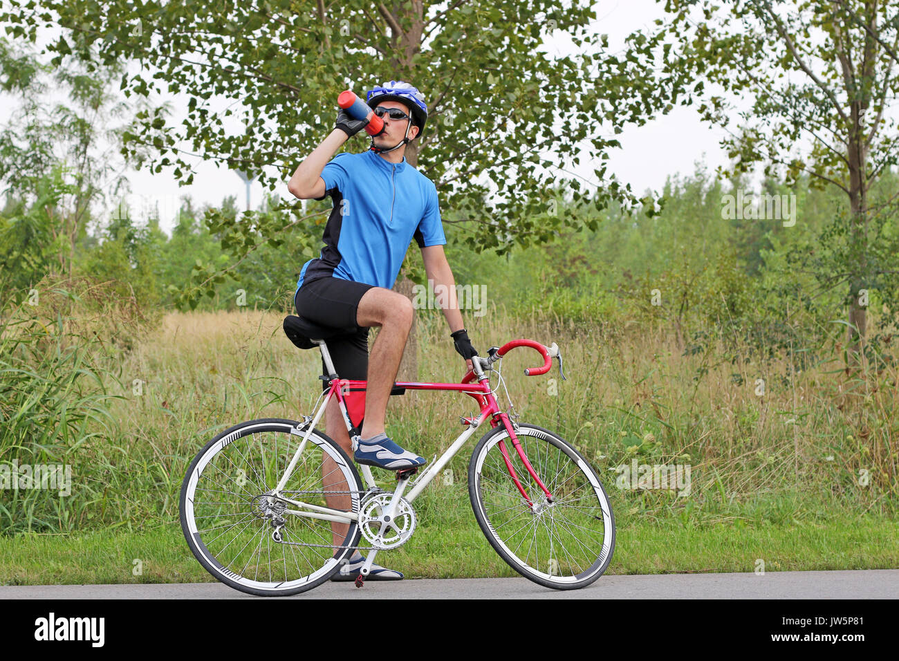Male cyclist drinking water hi-res stock photography and images - Alamy