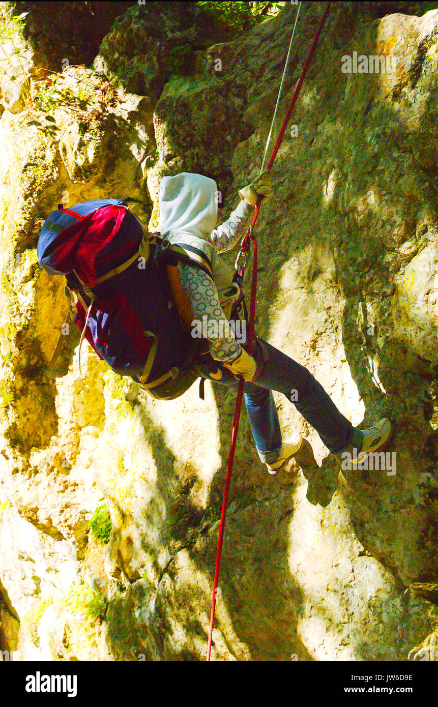 Backpacking woman hiking on steep hi-res stock photography and images ...