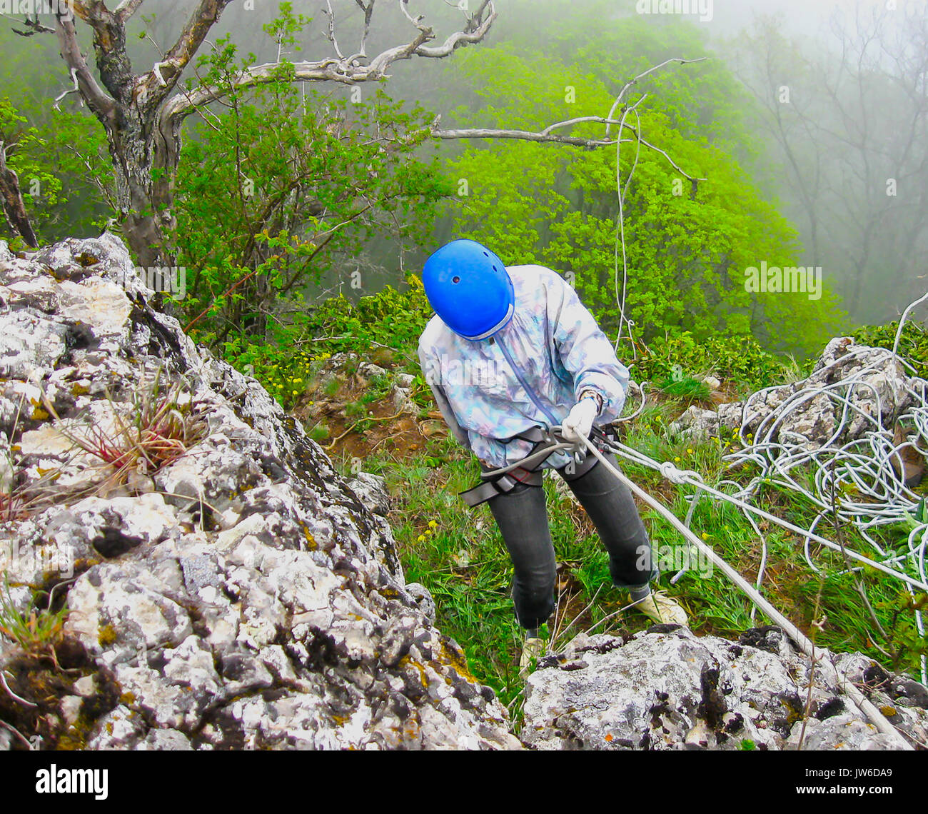 Woman hiker climbing steep slope hi-res stock photography and images ...