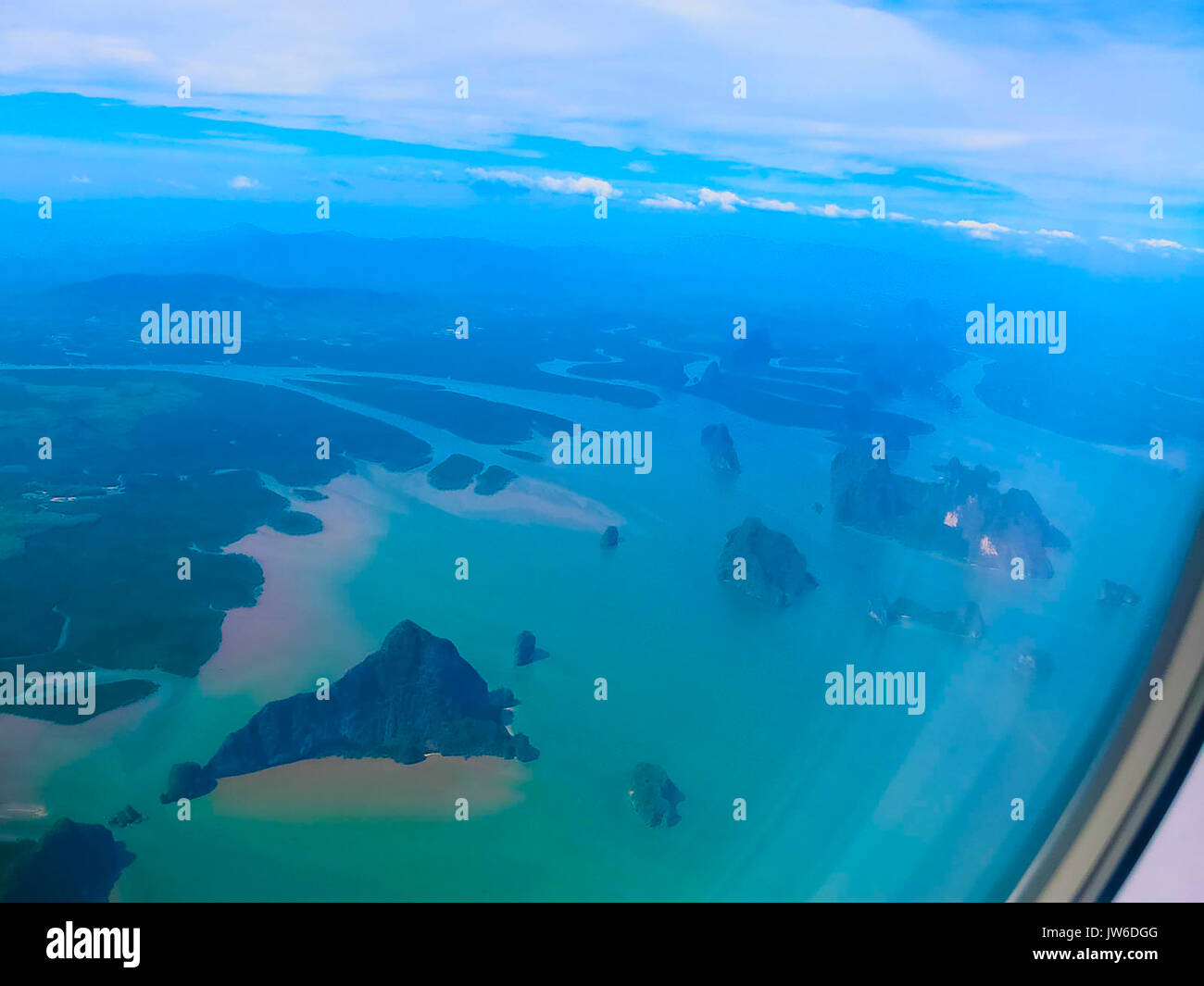 The sea view from airplane porthole window Stock Photo - Alamy