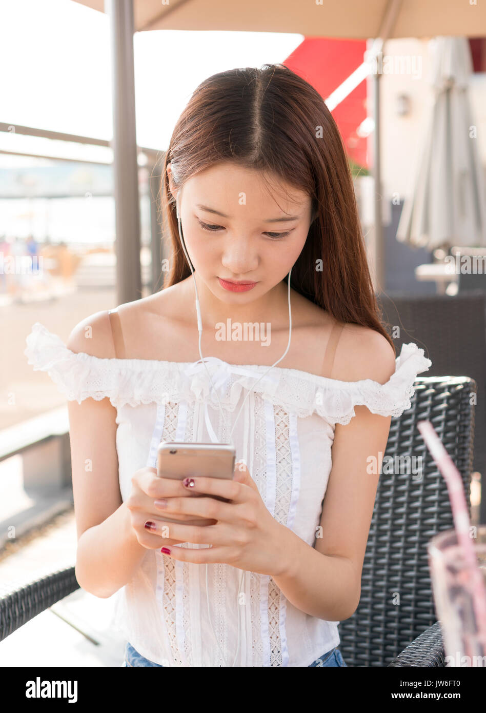 Chinese girls playing phone Stock Photo - Alamy