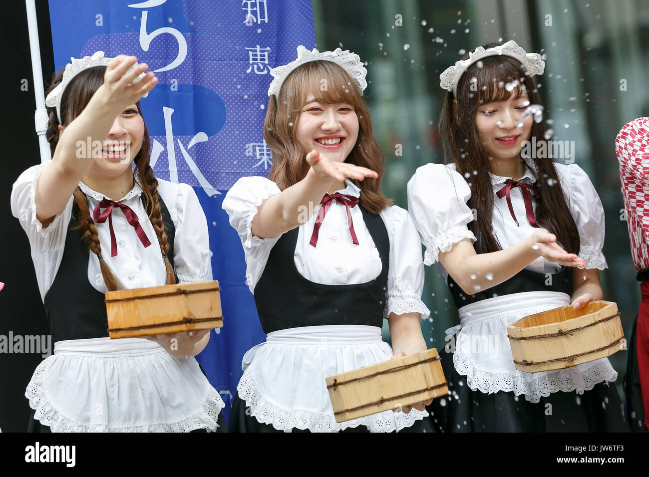 Tokyo, Japan. 11th August, 2017. Maid cafe waitresses sprinkle water ...