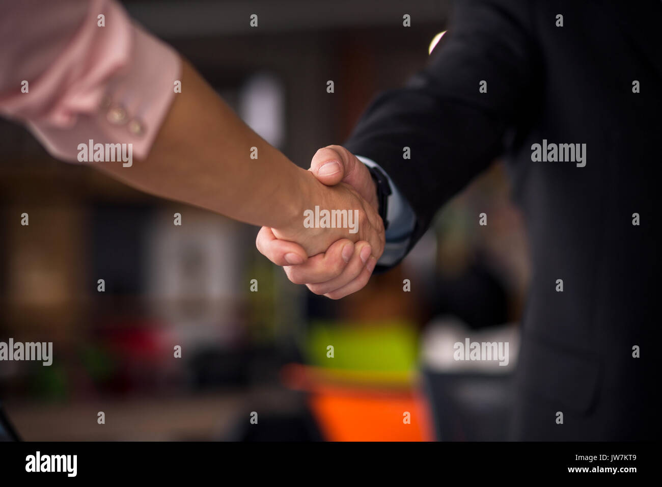 Close up view of business partners shaking hands Stock Photo - Alamy