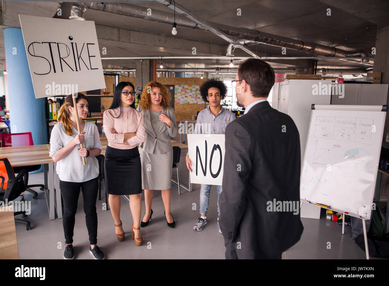 Loft style modern office, employees striking Stock Photo - Alamy