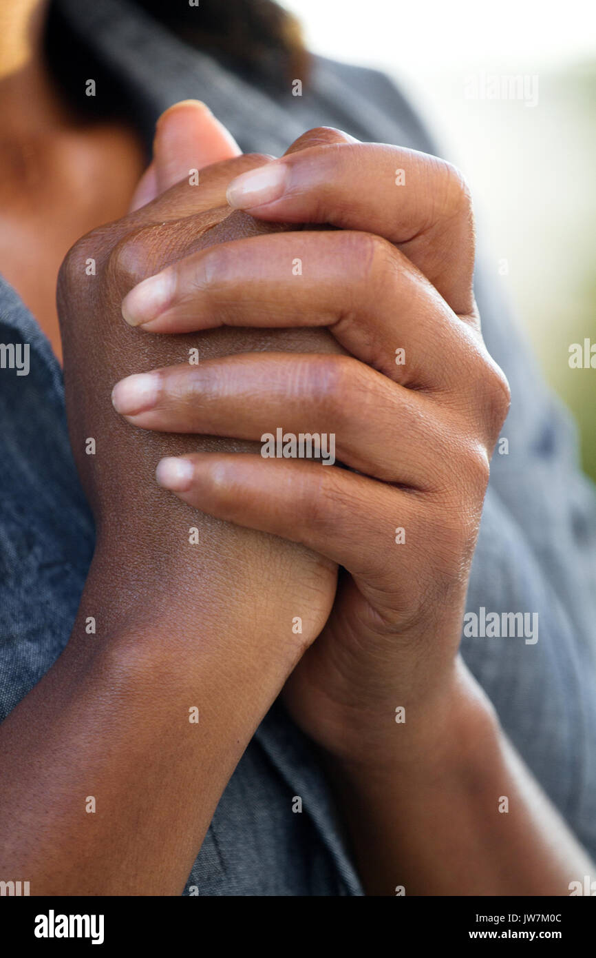 Closeup of a woman praying Stock Photo - Alamy