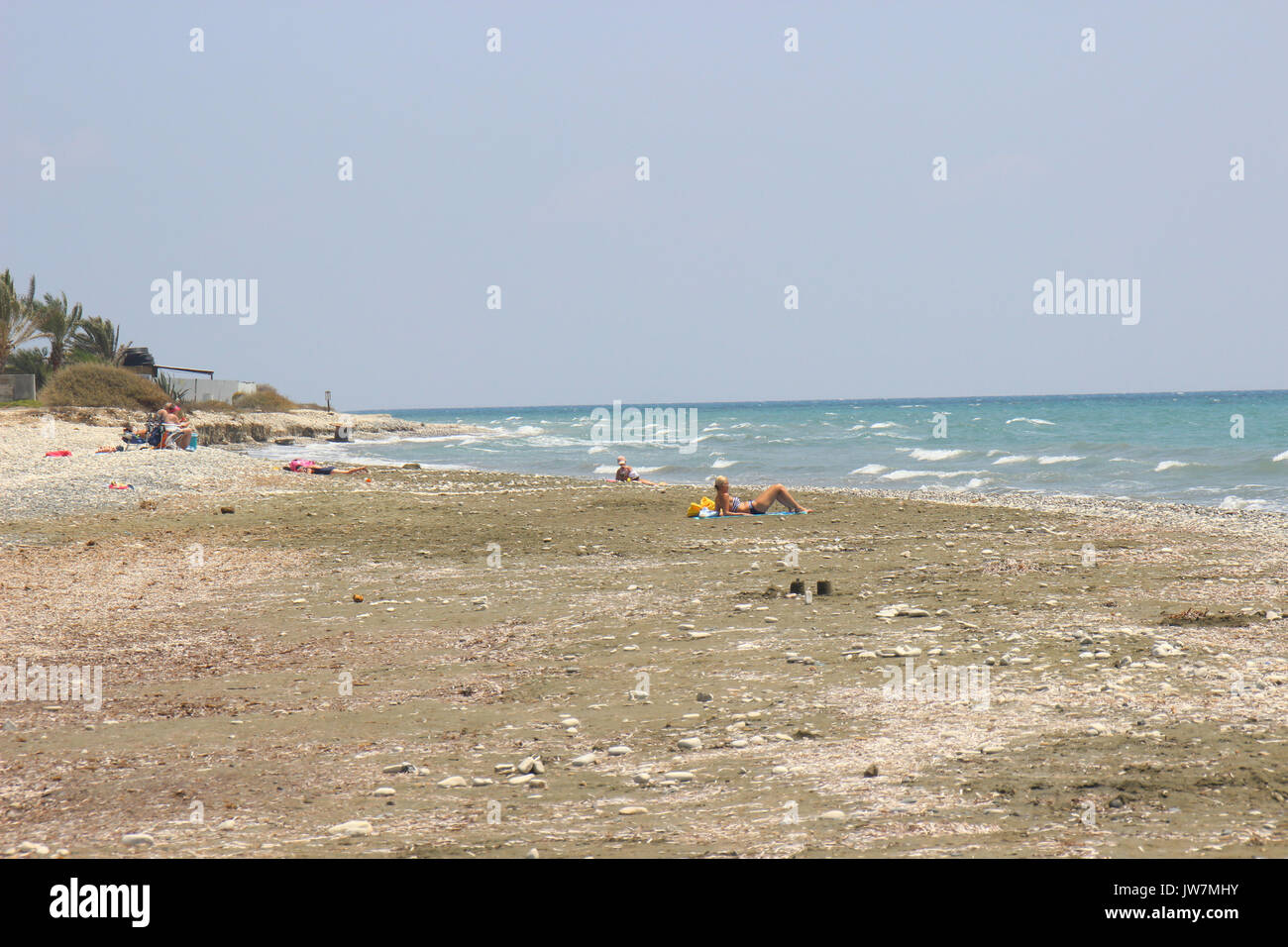 Sunbather on Beach Stock Photo - Alamy