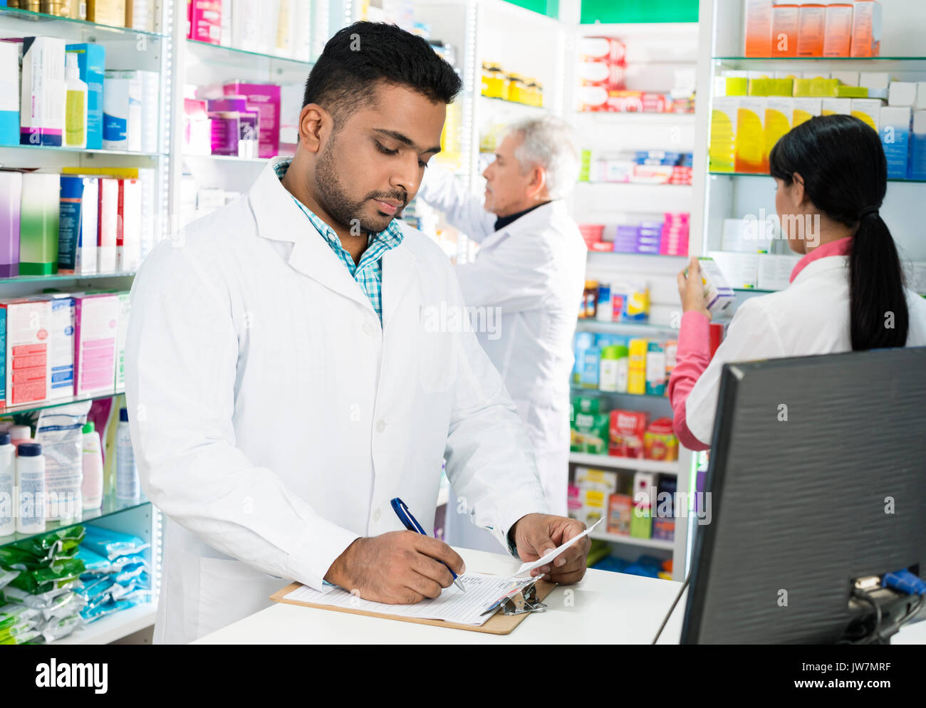 Indian man in retail shop counter hi-res stock photography and images ...
