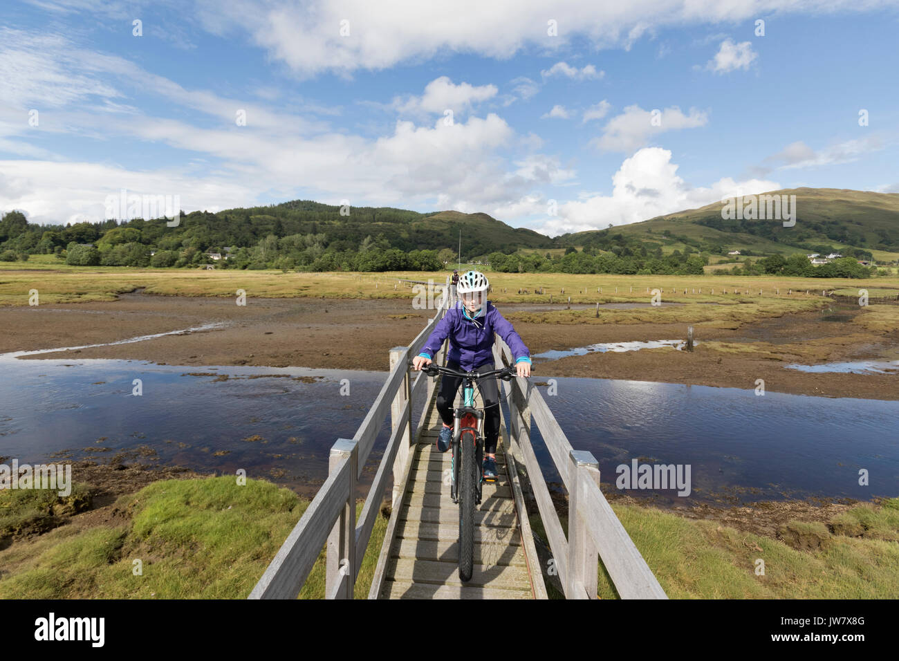 Cycling across Jubilee bridge, Appin, Highland Scotland Stock Photo - Alamy