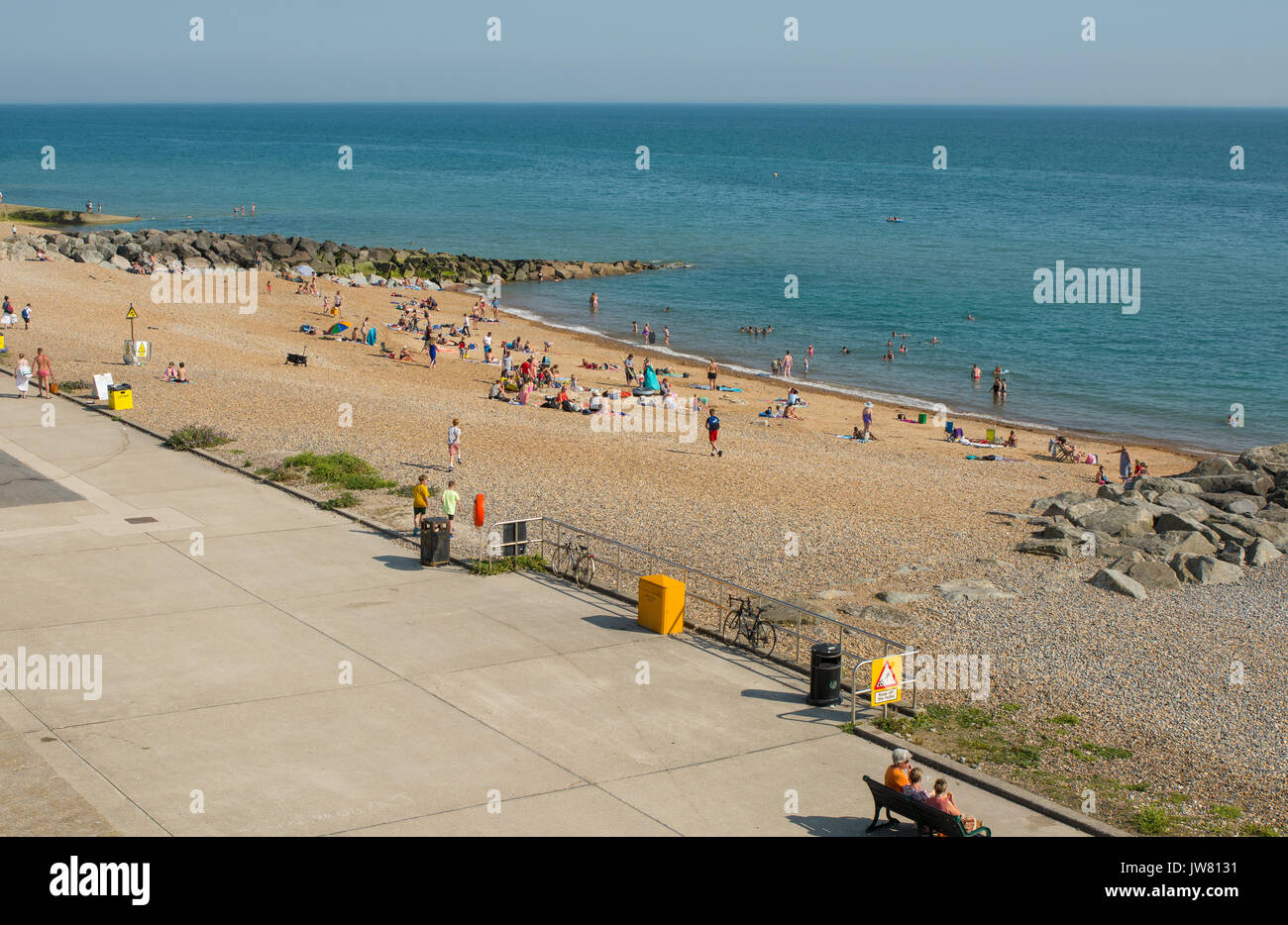 Shingle beach and sea at the seafront in Rottingdean near Brighton ...